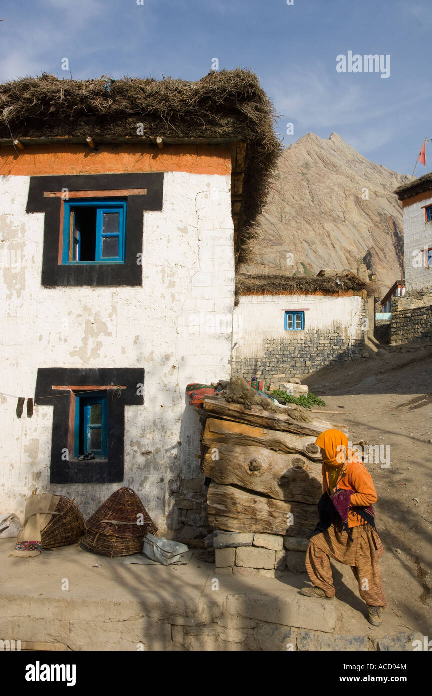 India Himachal Pradesh Spiti Pin valley Mud woman entering her house ...
