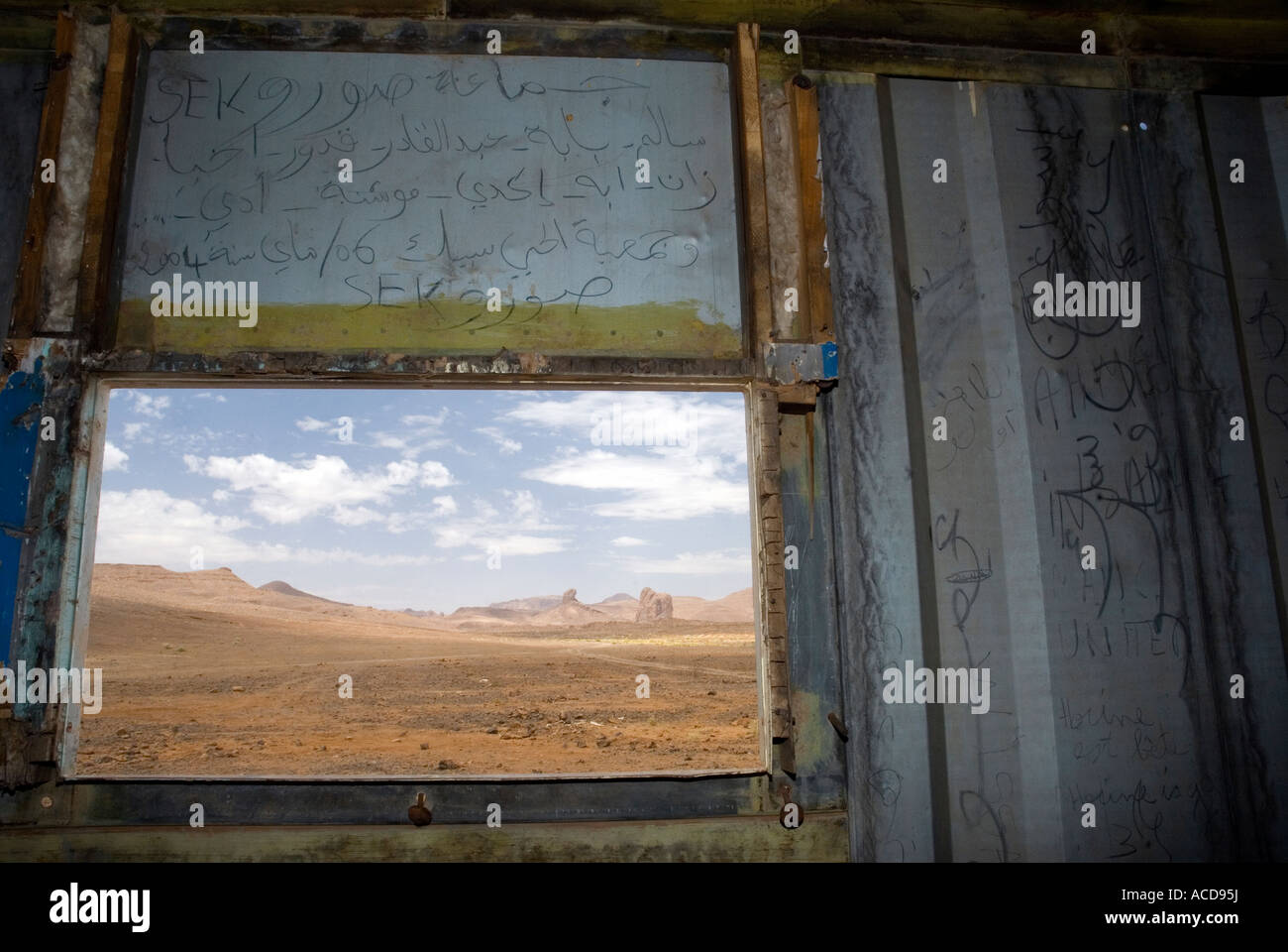 A window in a deserted hut on the road to Assekrem frames a spectacular ...