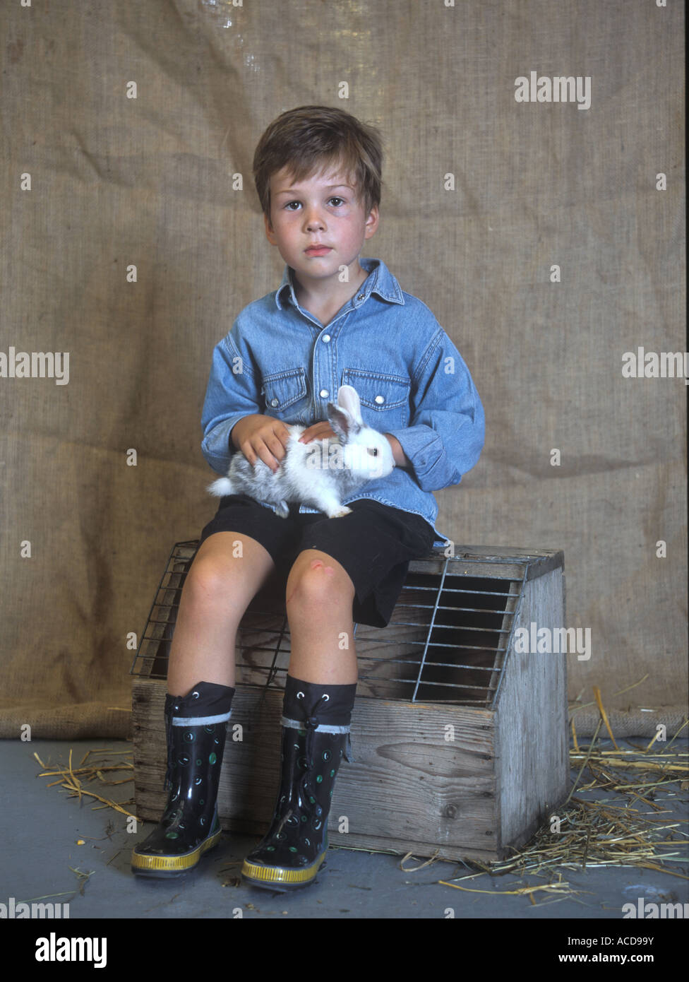 farmer boy and rabbit Stock Photo - Alamy