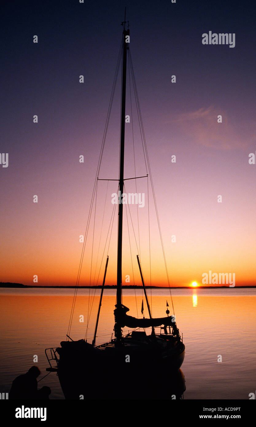A sailing-boat and sunset Stock Photo - Alamy