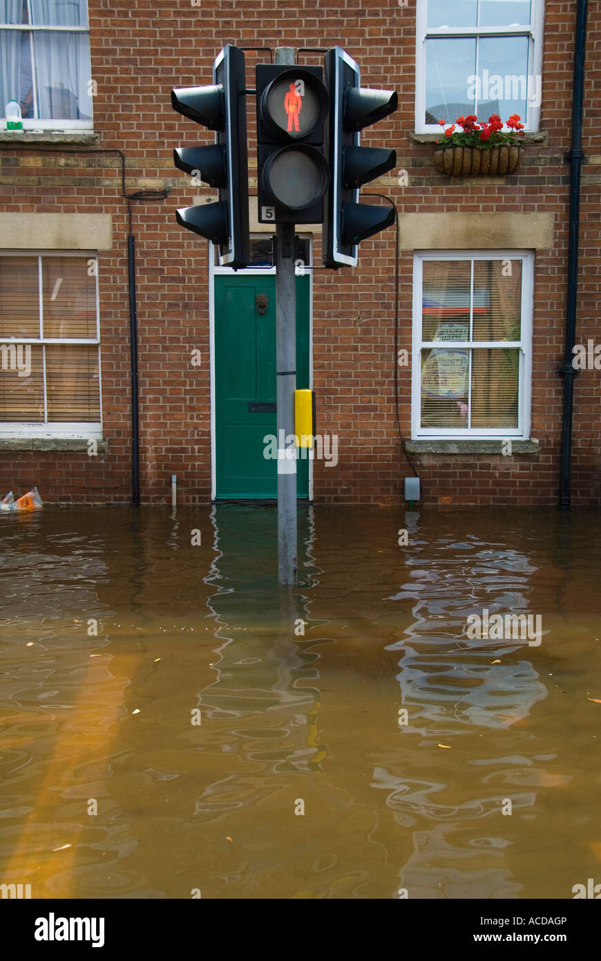 A Traffic Light Still Working on a Flooded Street Stock Photo - Alamy