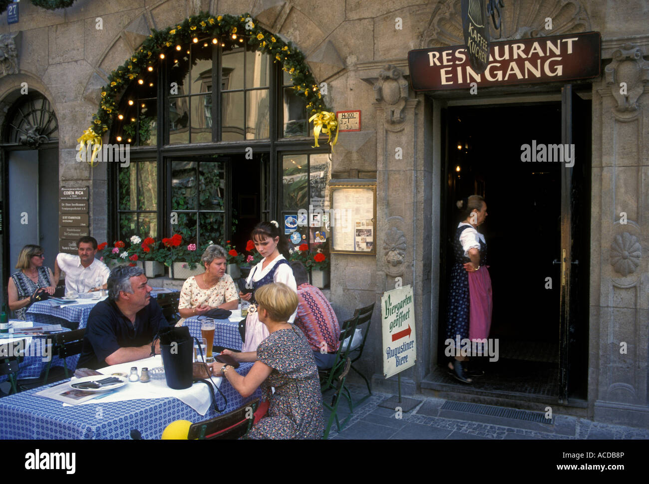 German people, family, eating lunch, outdoor dining, table service ...