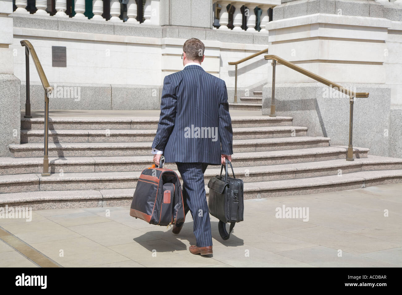 Business executive approaching steps to office Stock Photo - Alamy