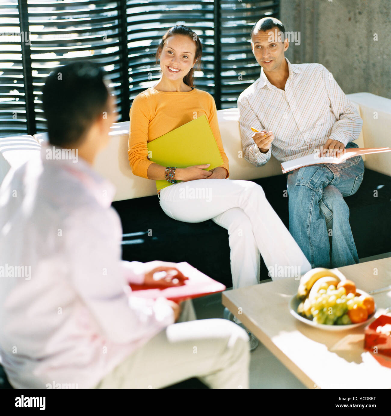 Three people in a conversation Stock Photo - Alamy