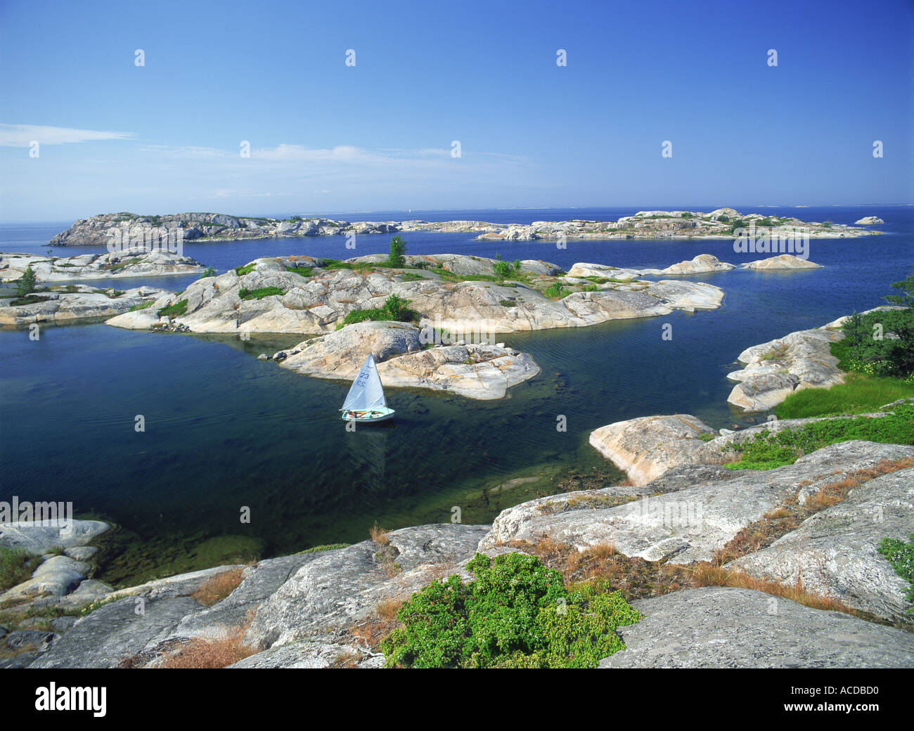 Sailboat passing rocky islands of Stora Nassa in Stockholm Archipelago ...