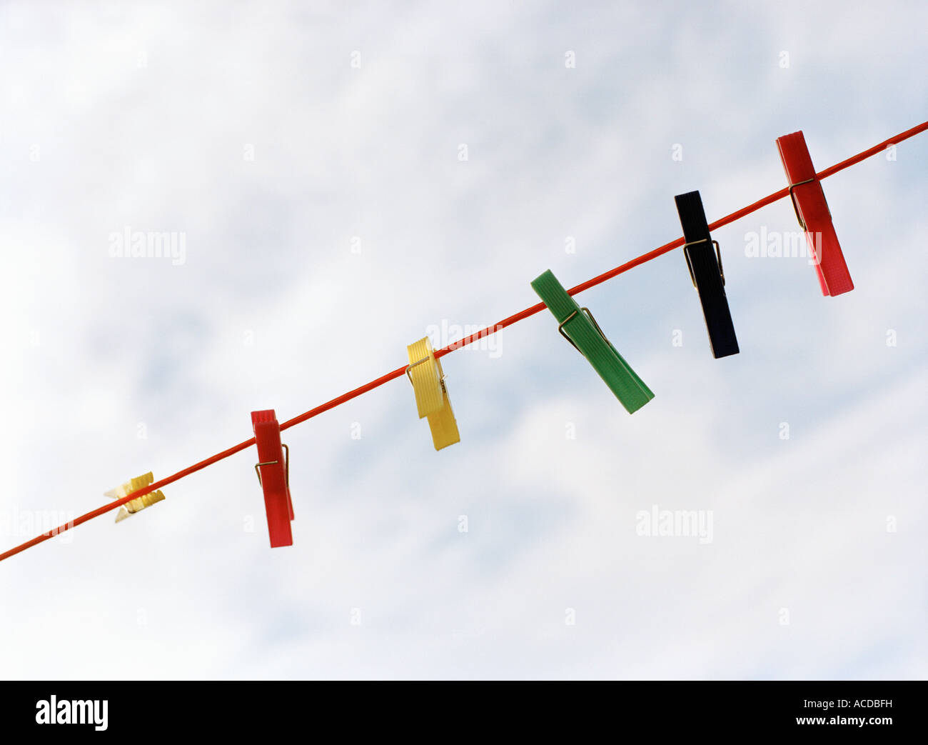 Clothes-pegs on a clothes-line Stock Photo - Alamy