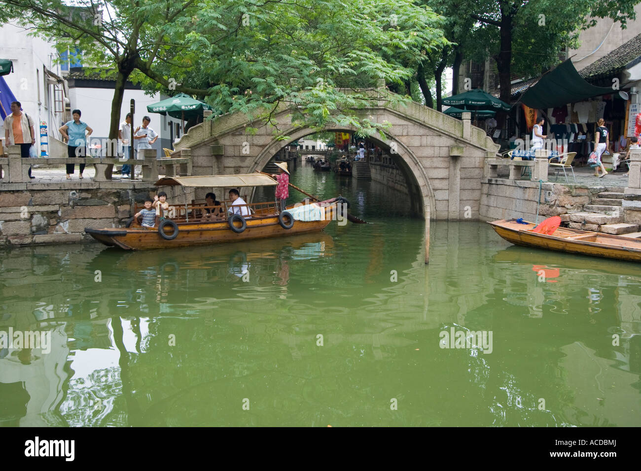 Tourist Wooden Boat Passing under Ancient Stone Bridge Tongli Canal Town China Stock Photo - Alamy