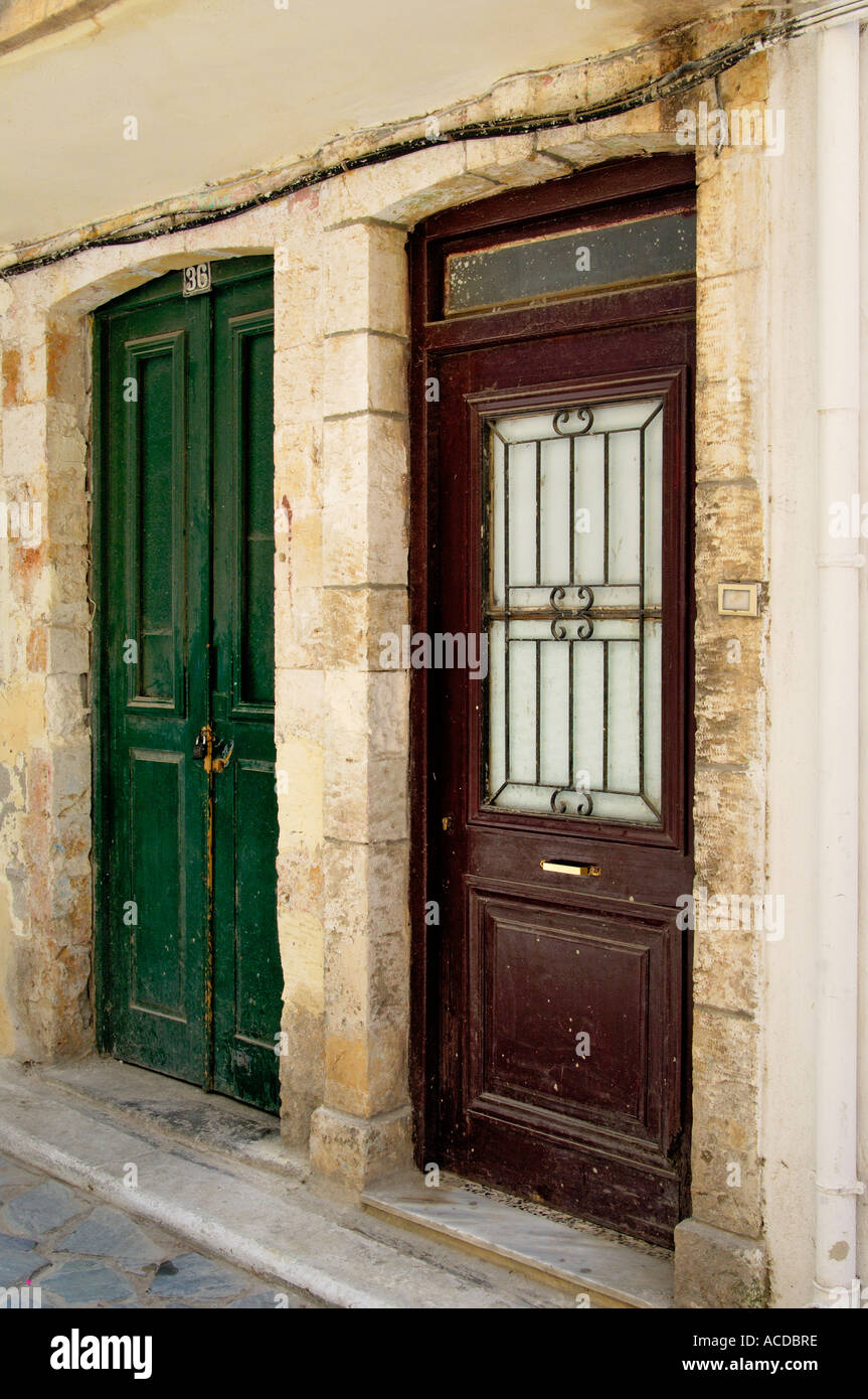 Two wooden doors in old stone wall Chania Crete Greece Stock Photo - Alamy