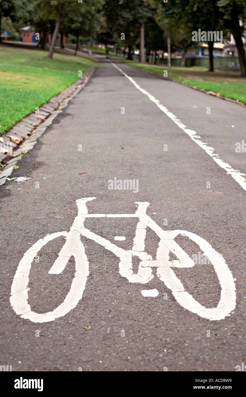 Bicycle lane sign painted on pathway in park Stock Photo - Alamy