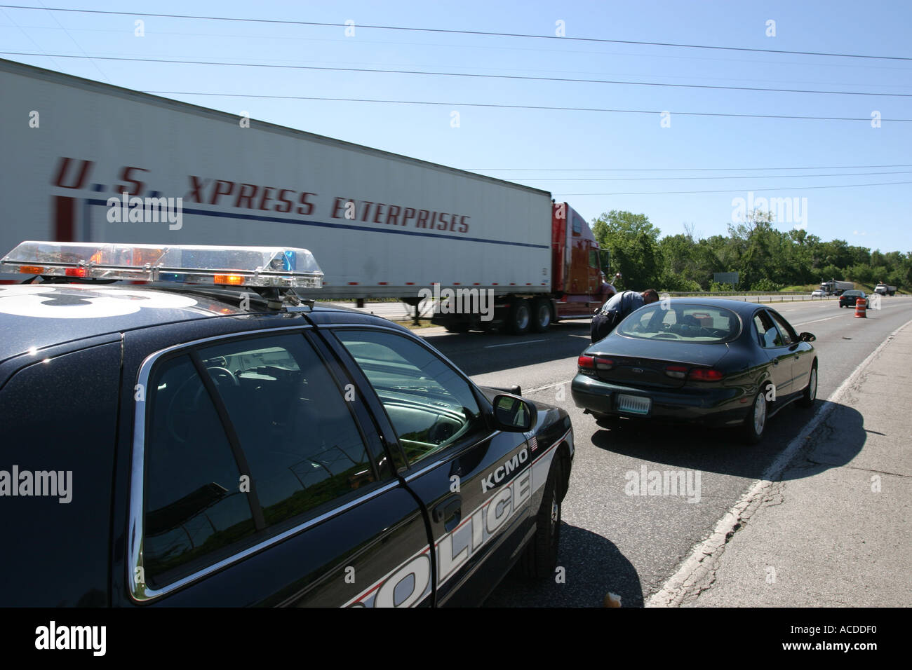 Traffic police working on dangerous road Heavy traffic. Kansas City, MO ...
