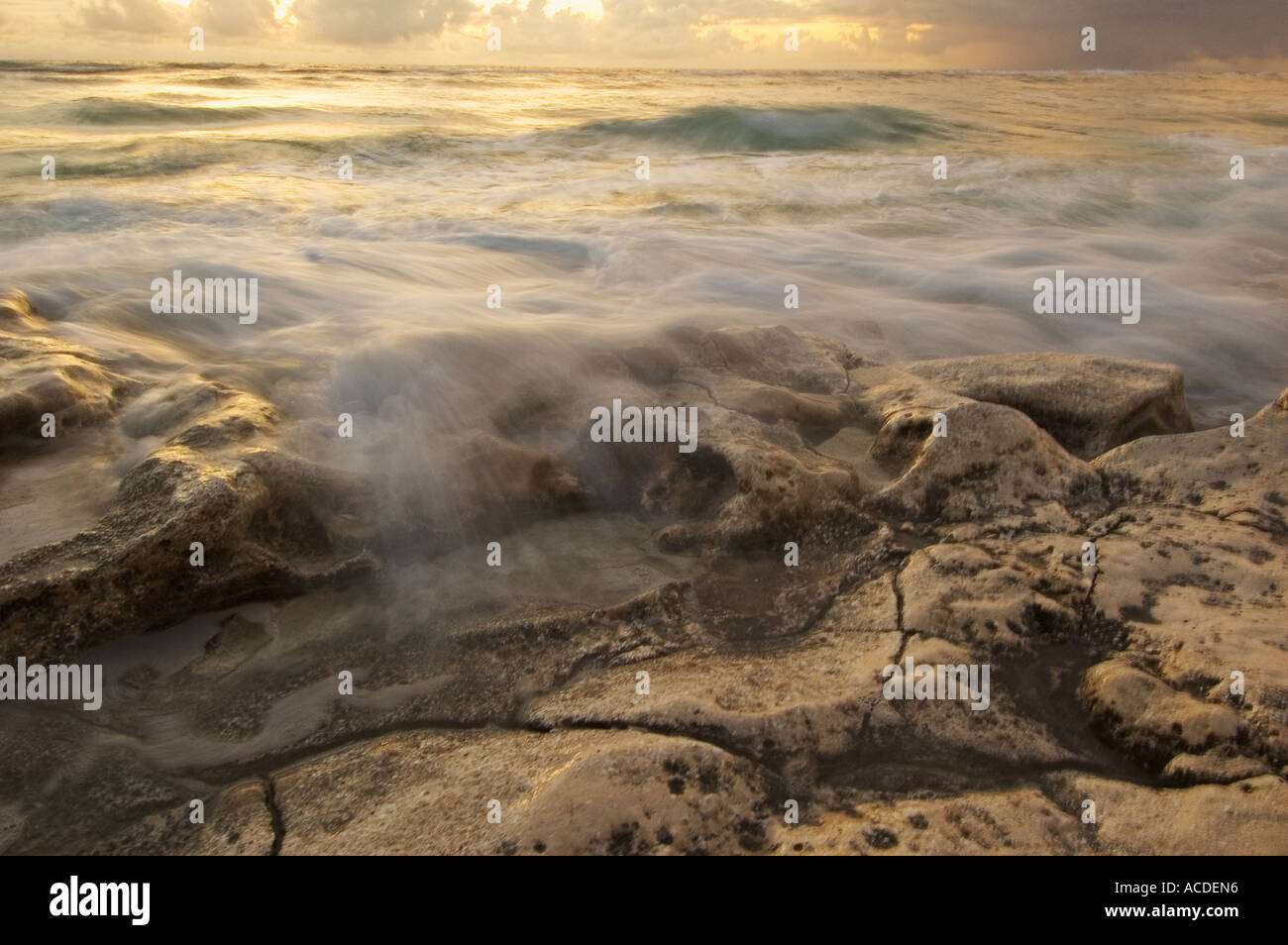 Waves breaking on the beach at sunset Gielop Island Ulithi Atoll Yap ...