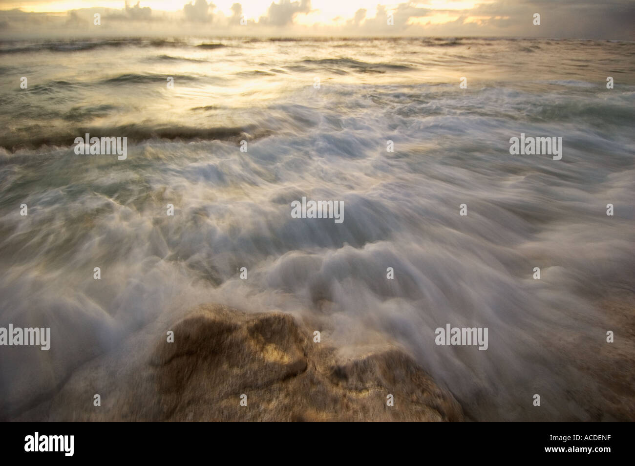 Waves breaking on the beach at sunset Gielop Island Ulithi Atoll Yap ...