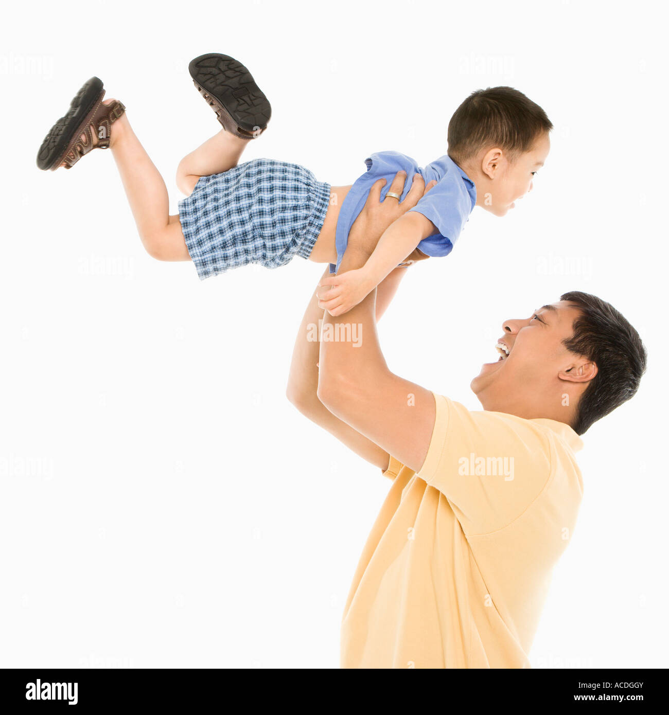Father son swinging Cut Out Stock Images & Pictures - Alamy