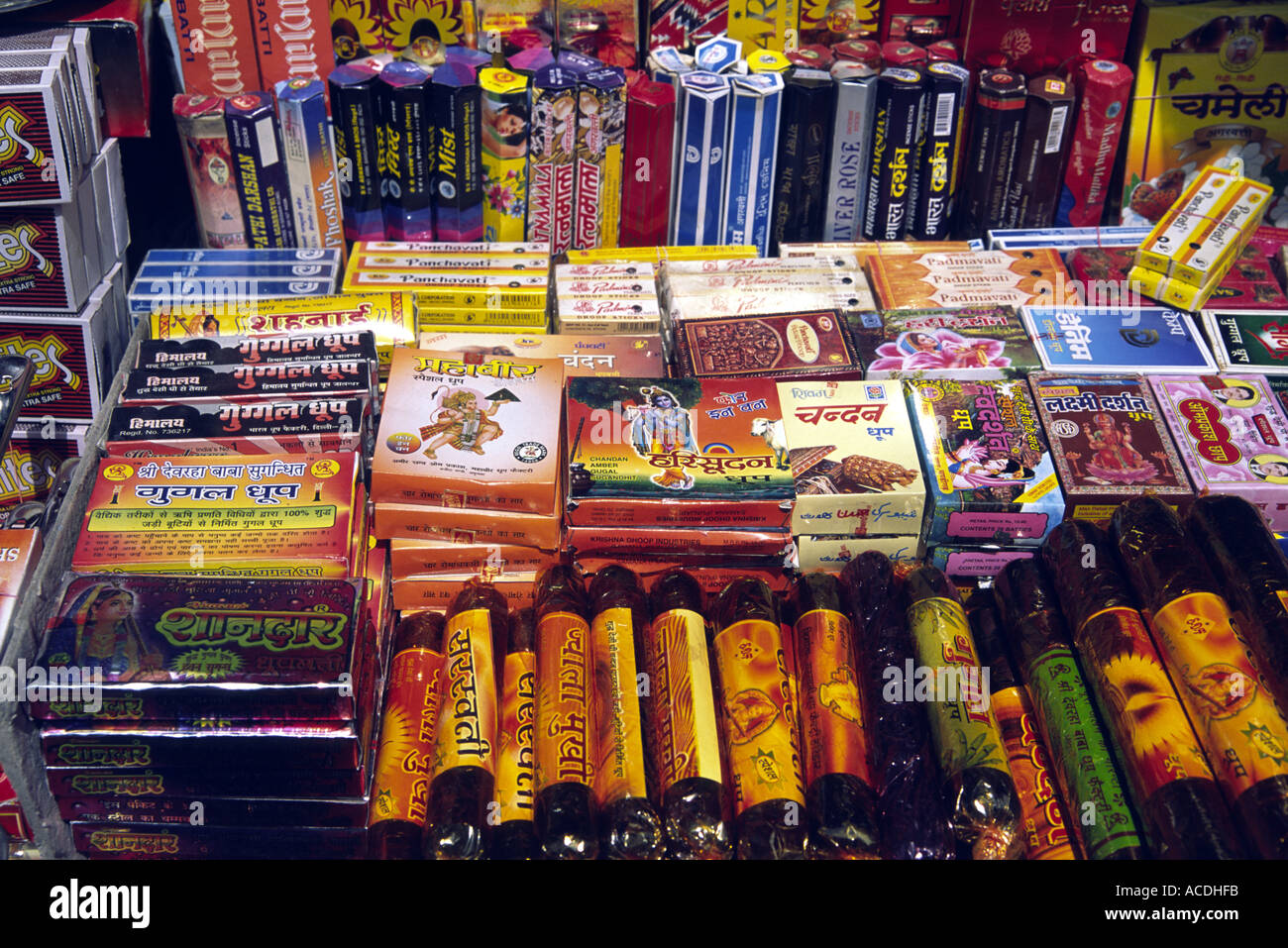 A horizontal view of a colourful display of packets of incense sticks ...