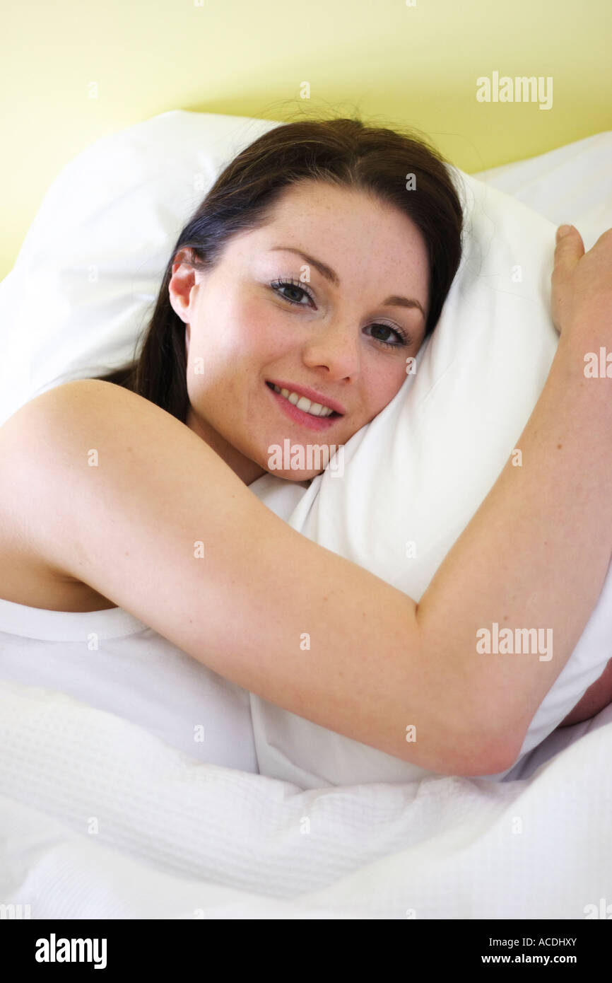 young woman awake in bed Stock Photo - Alamy