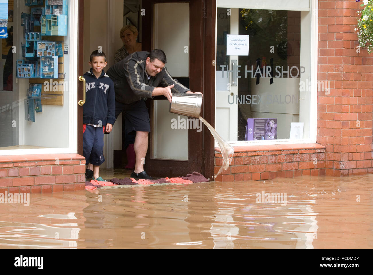 Man baling out flooded shop in Tenbury Wells June 2007 Stock Photo - Alamy