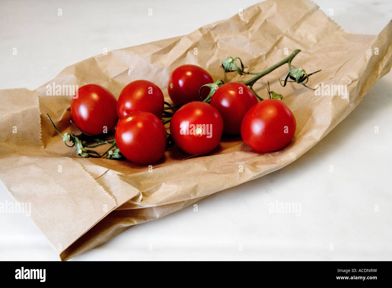 Tomatoes on a paper bag Stock Photo - Alamy