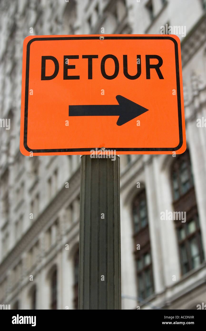 Urban DETOUR sign with arrow pointing right Stock Photo - Alamy