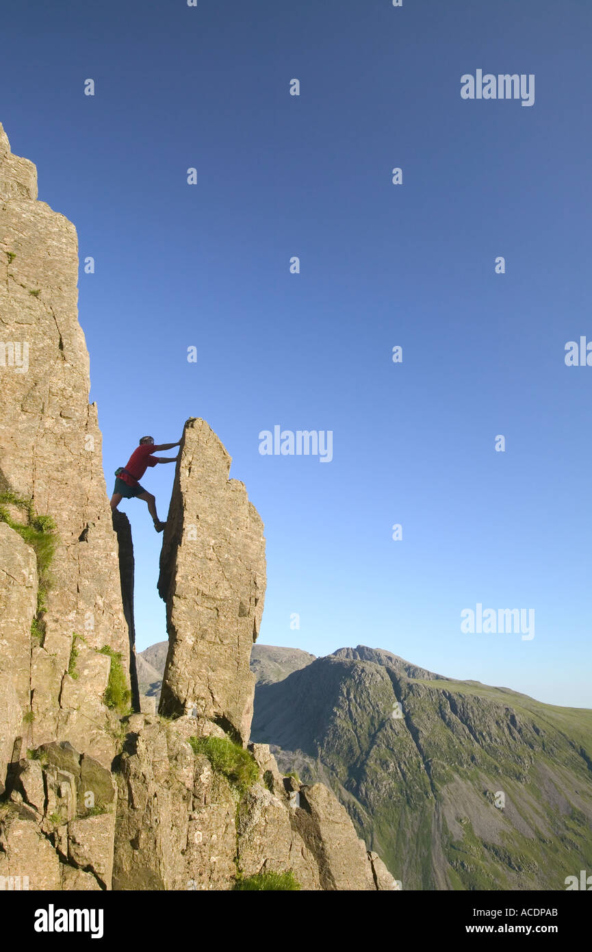 Climber on a pinnacle on the climbers traverse Great Gable Lake ...