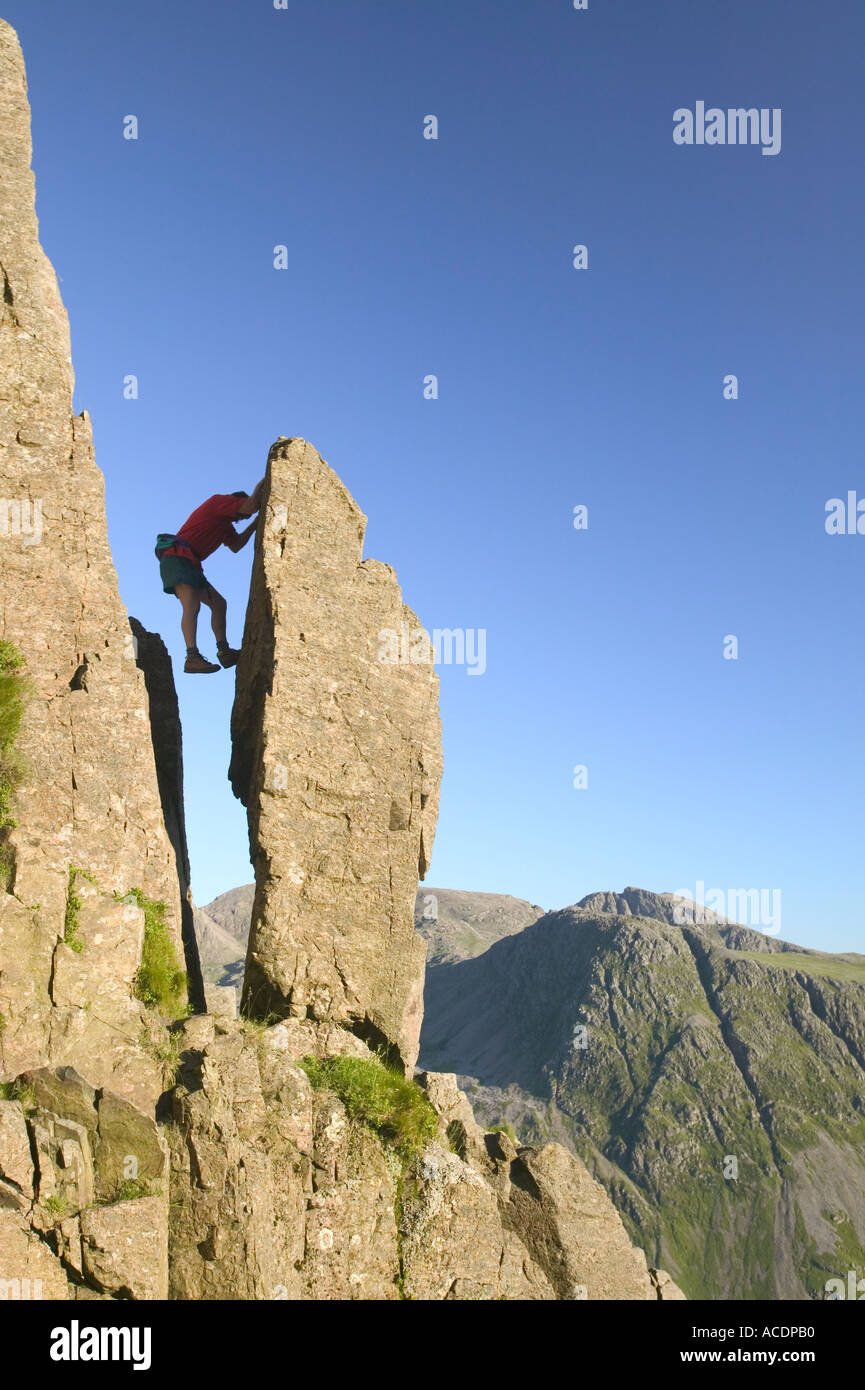 Climber on a pinnacle on the climbers traverse Great Gable Lake ...