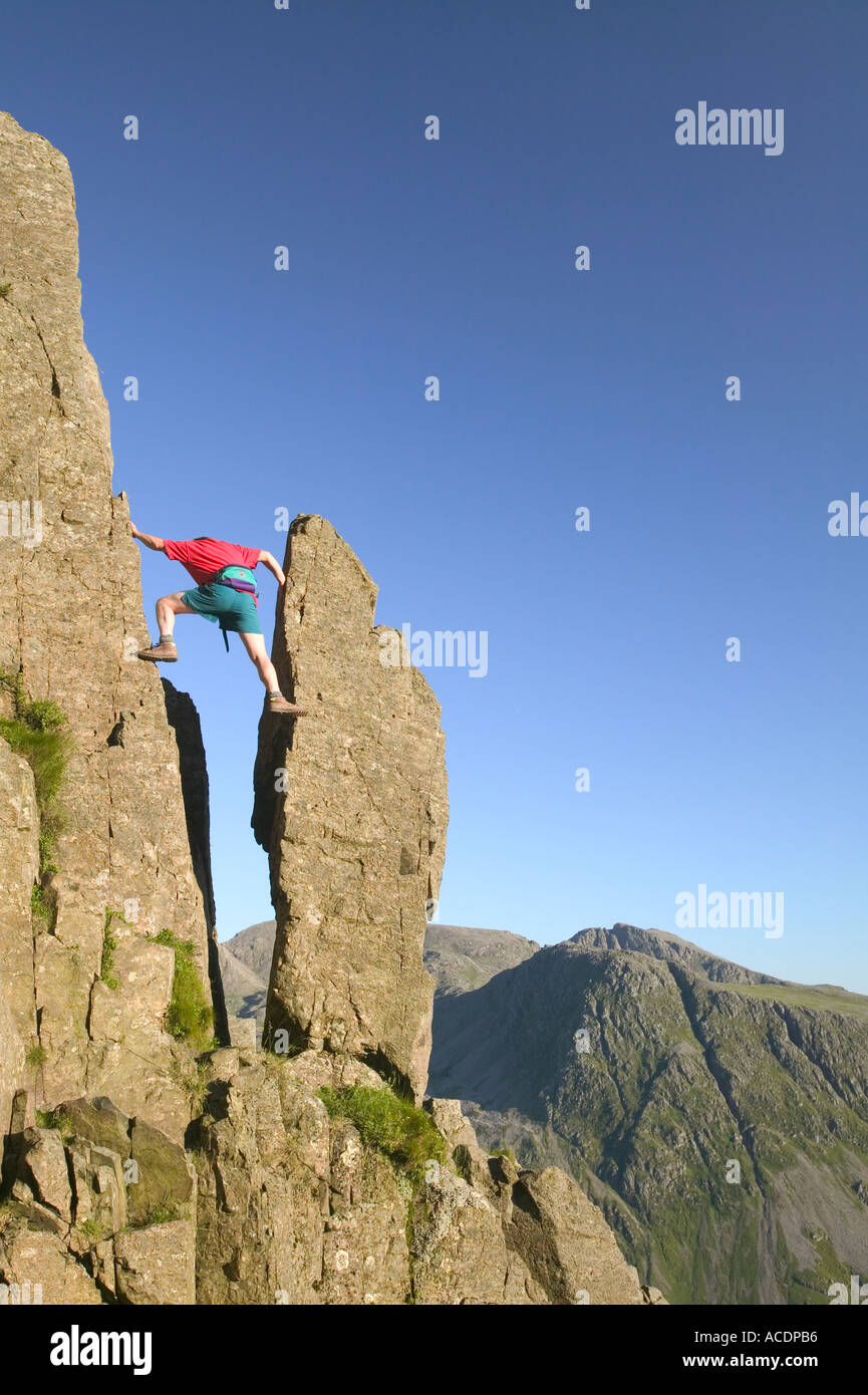 climber bridging on a pinnacle on the climbers traverse Great Gable ...