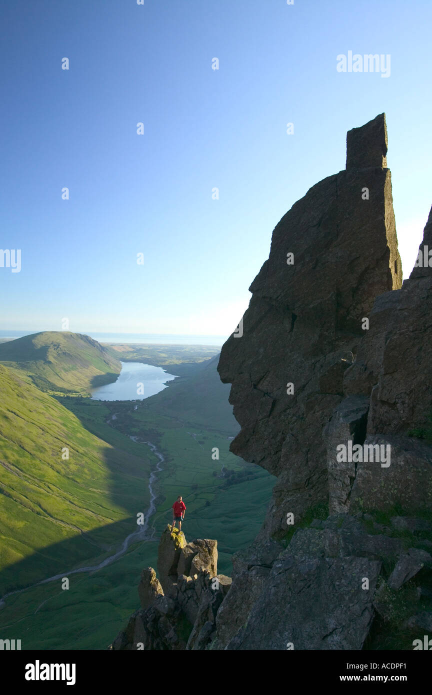 a climber below the Sphinx rock on Great Gable with Wasdale valley and ...