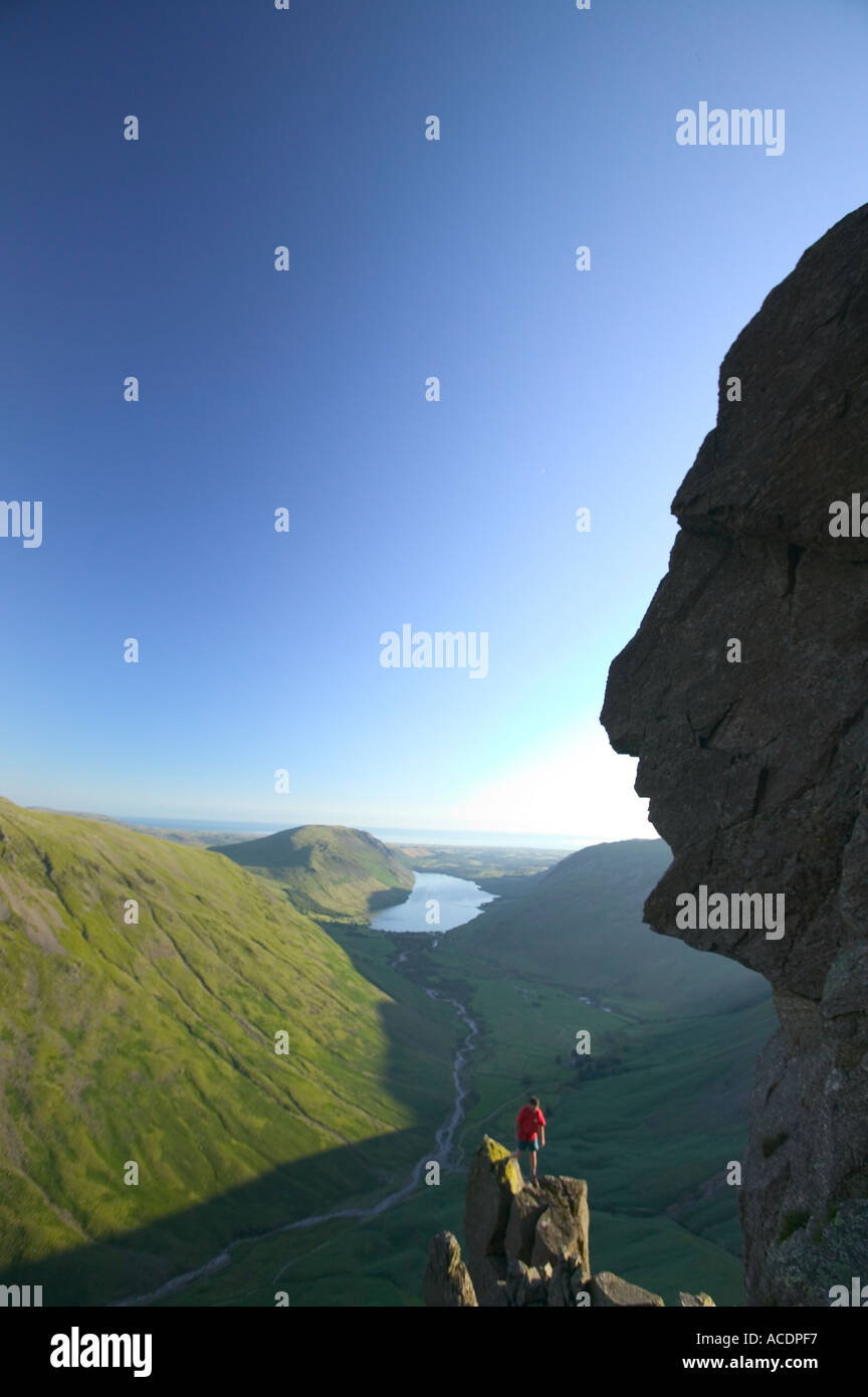 a climber below the Sphinx rock on Great Gable with Wasdale valley and ...
