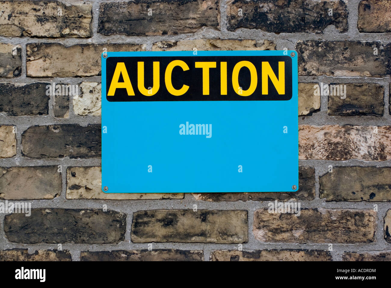 AUCTION sign with blank space on old brick wall Stock Photo - Alamy
