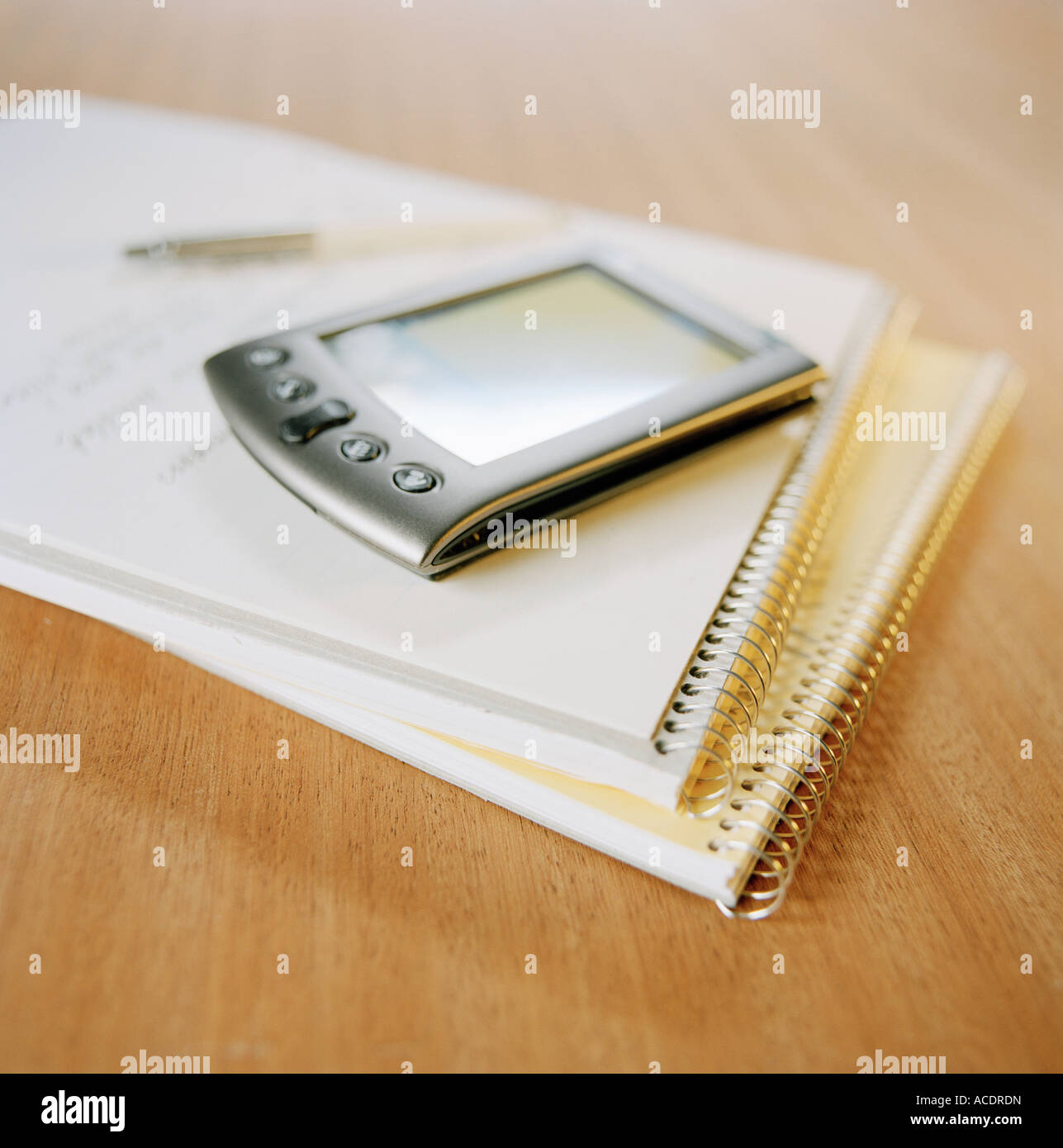 A palm pilot on note pads Stock Photo - Alamy