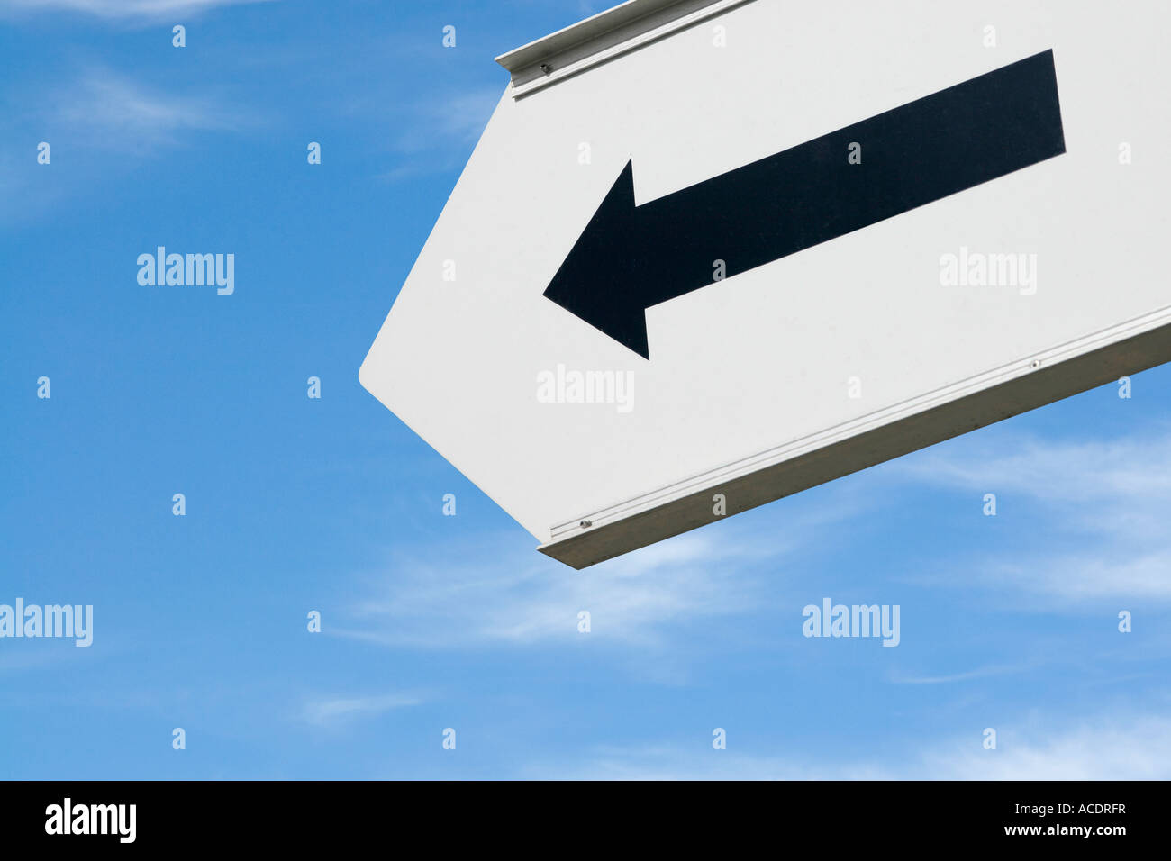 Close up of arrow pointing left on directional sign Stock Photo - Alamy