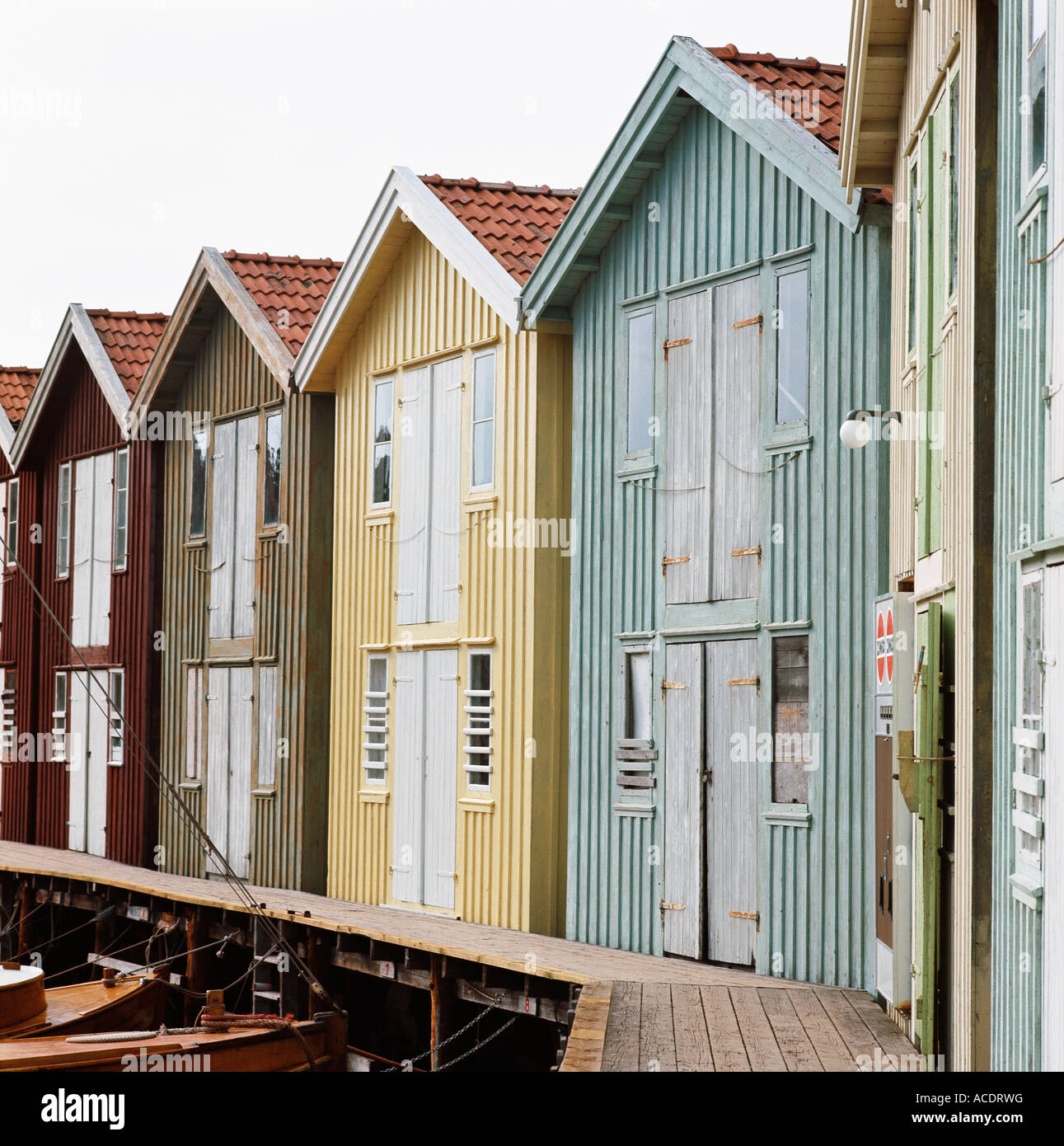 Boat houses in different colors Stock Photo - Alamy