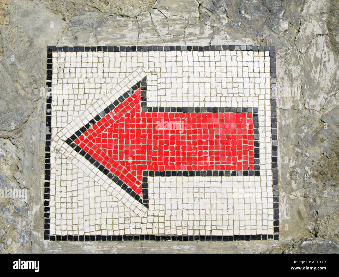 Red arrow mosaic tile sign Stock Photo - Alamy