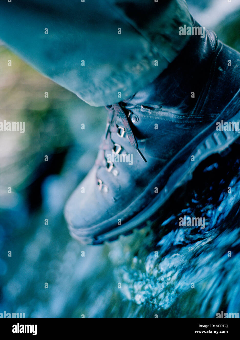 A boot walking in water Stock Photo - Alamy
