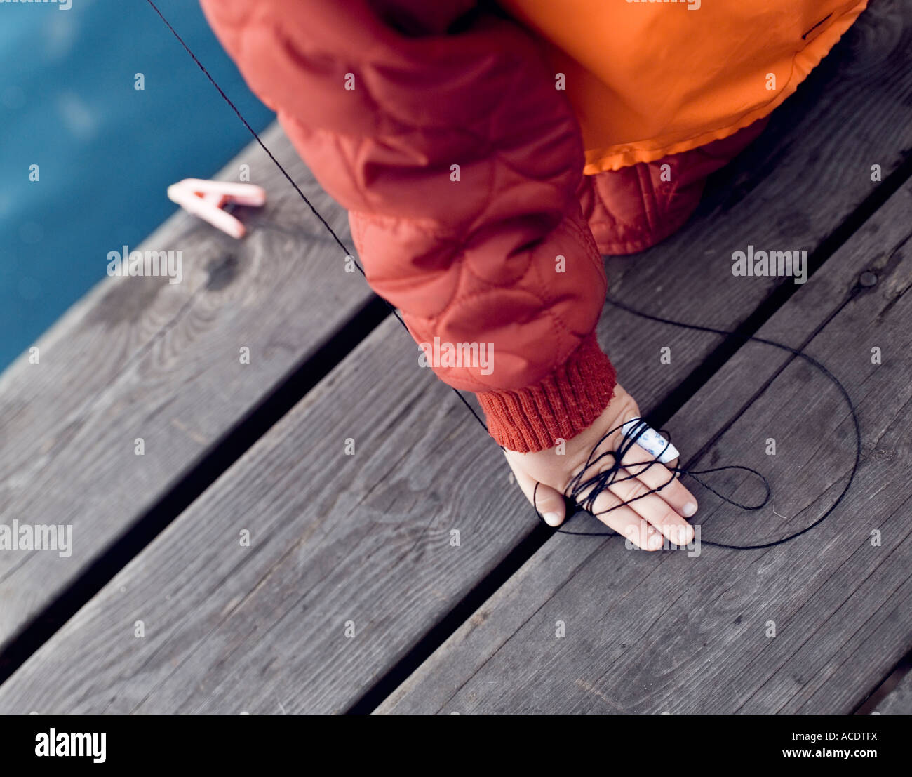 Crabfishing from jetty Stock Photo - Alamy
