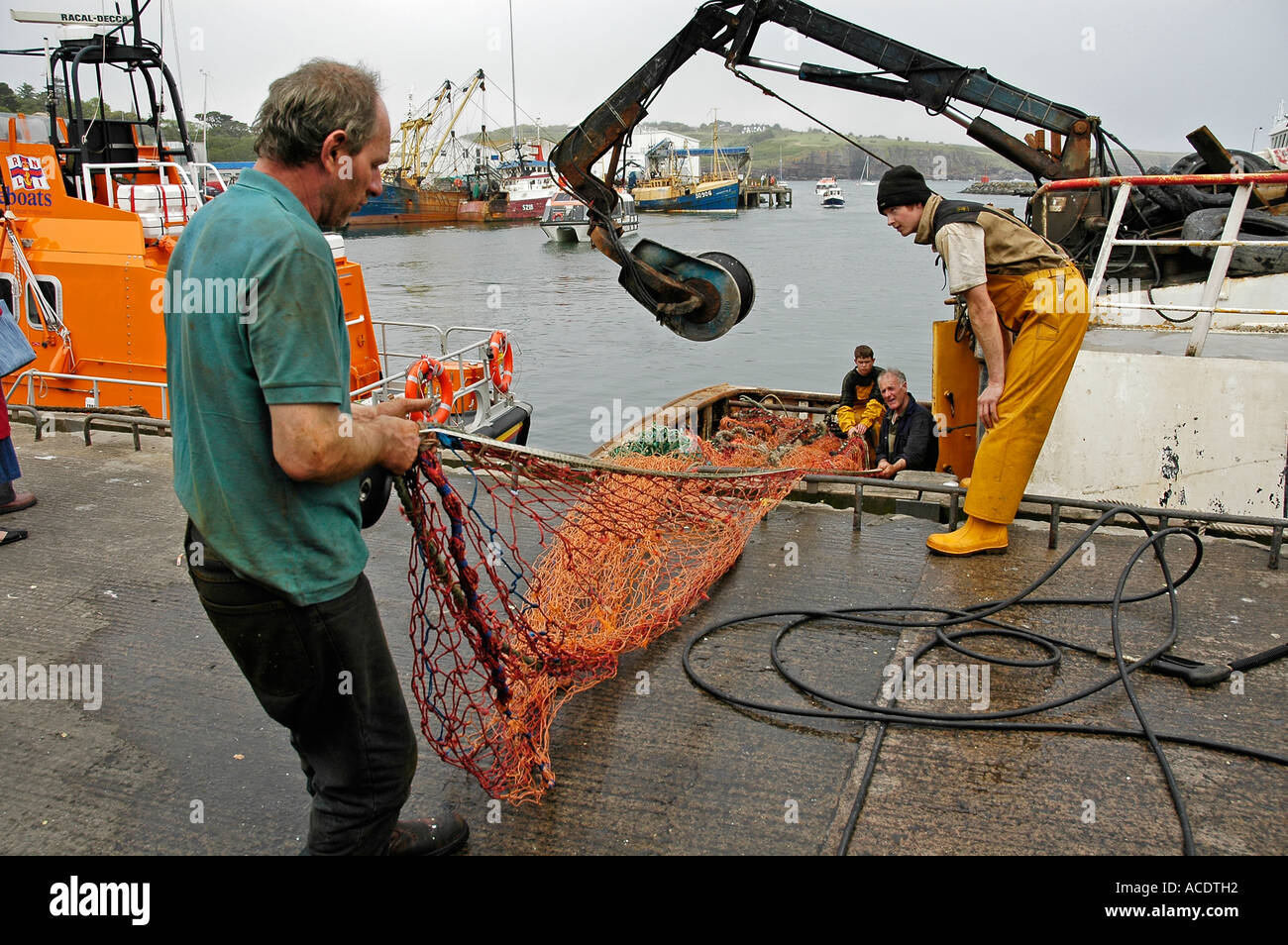fisherman pulling net, Dunmore East, Ireland Stock Photo - Alamy