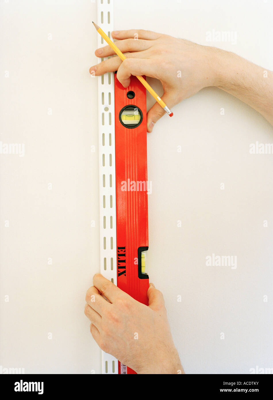 A water level on a wall Stock Photo - Alamy