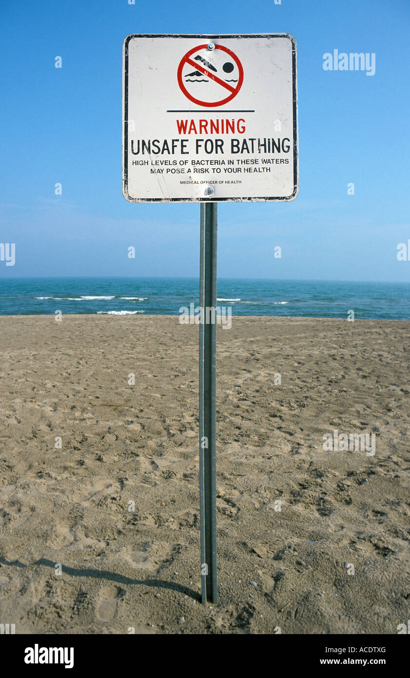 Warning - Unsafe For Bathing no swimming sign on beach Stock Photo - Alamy