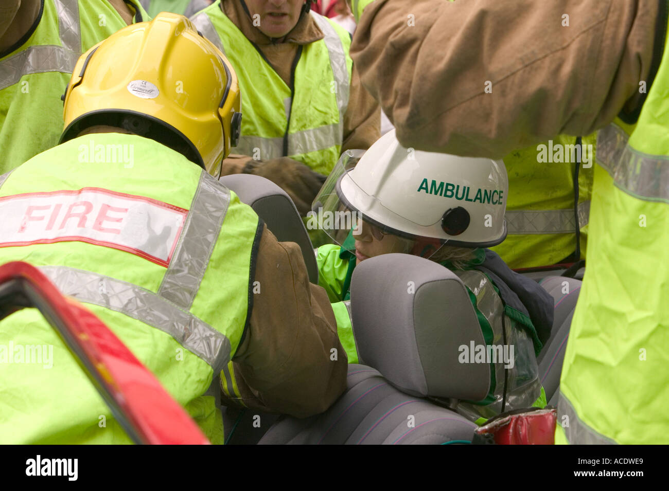Ambulance paramedic treat a car crash victim from within the car whilst ...