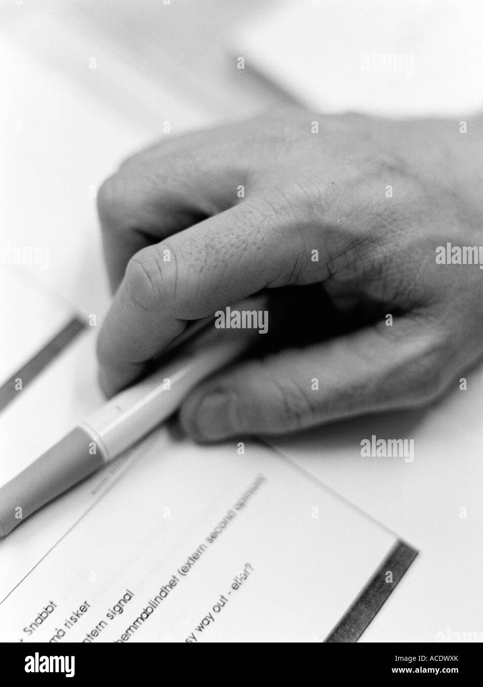 A hand holding a pen close-up Stock Photo - Alamy