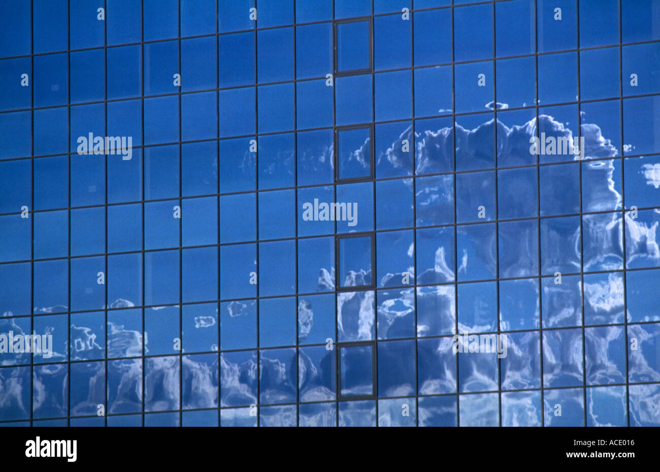 Reflection of sky and clouds in office window Stock Photo - Alamy