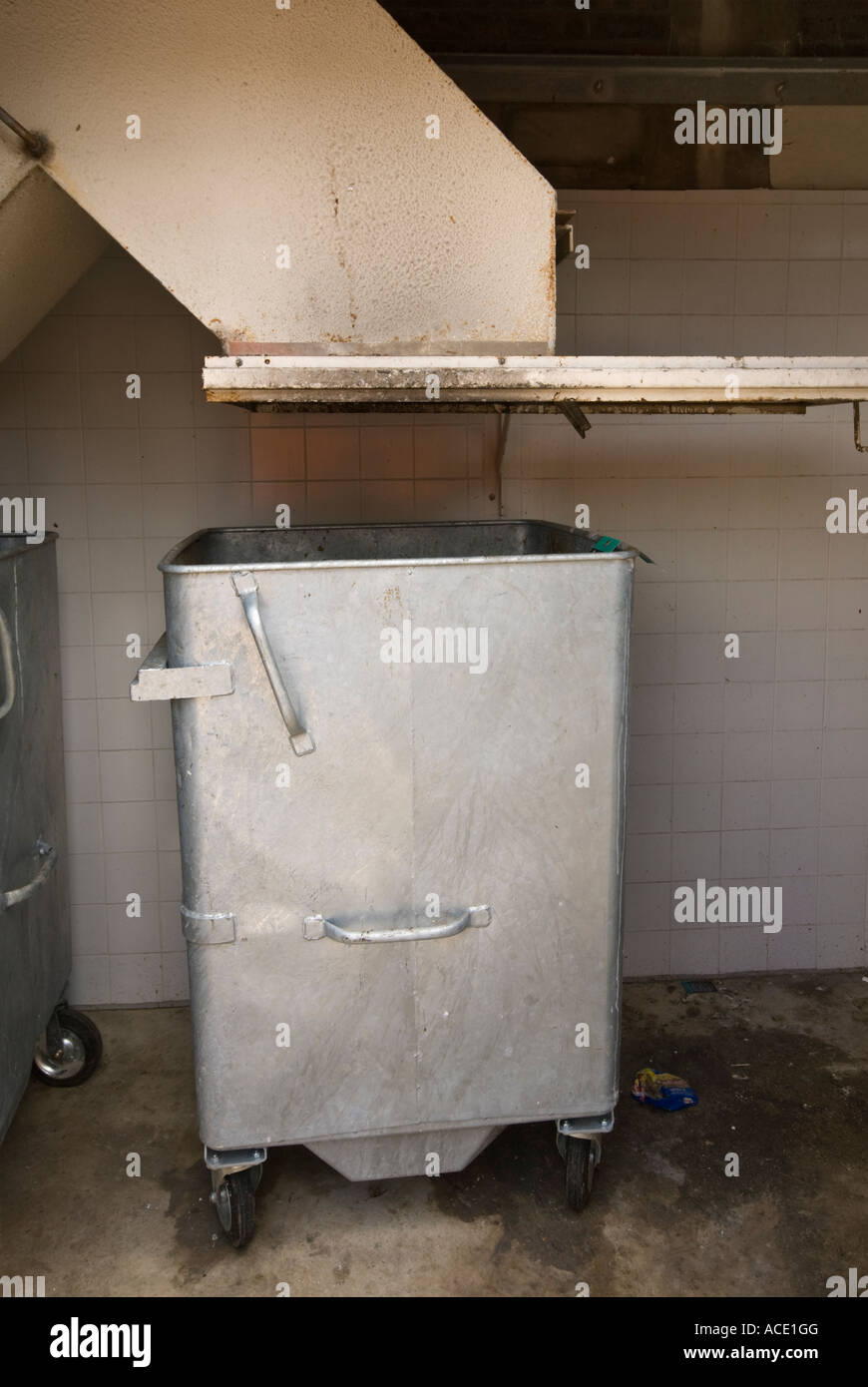 A garbage bin under a refuse shoot on a modern council estate Stock ...