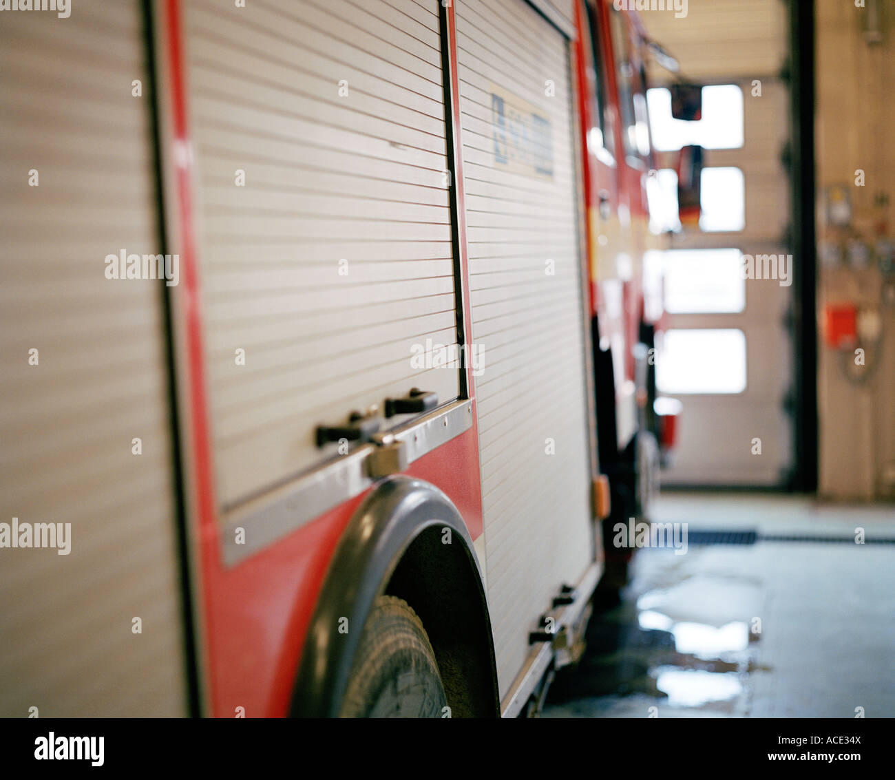 A fire-engine in a garage close-up Stock Photo - Alamy