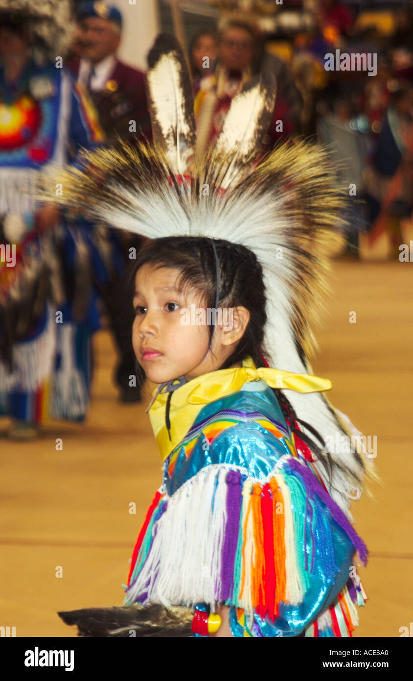 A young North American native in traditional dress at a graduation Pow ...