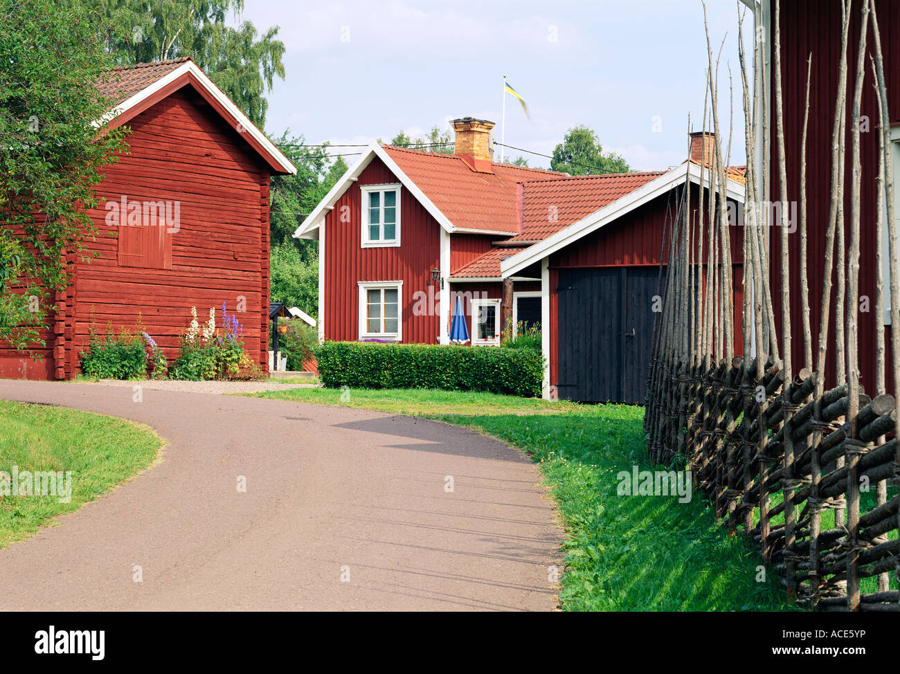 A red house by a country road Stock Photo - Alamy