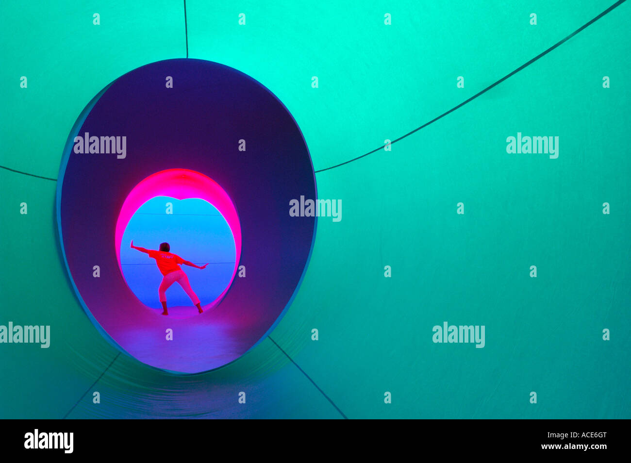 a visitor walks through the vibrant linked chambers of colourscape ...