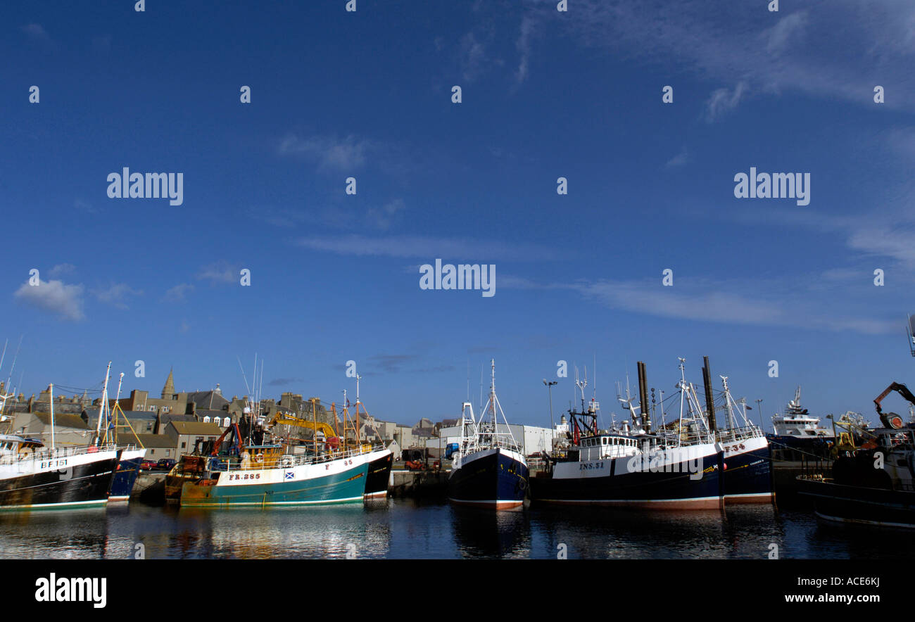 industrial fishing trawlers line up in Fraserburgh harbour ...