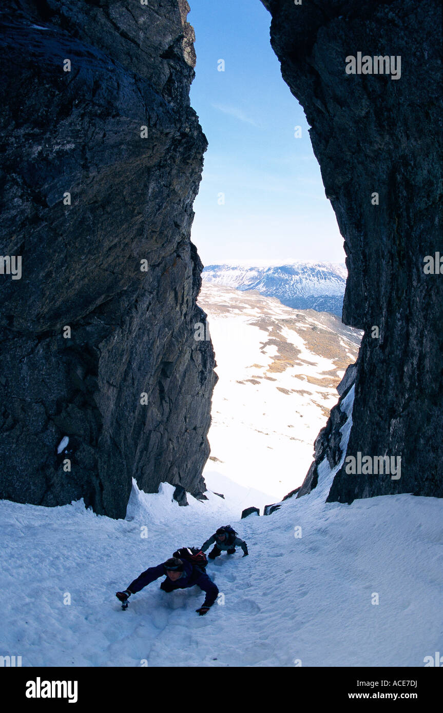 Two people climbing mountains Stock Photo - Alamy