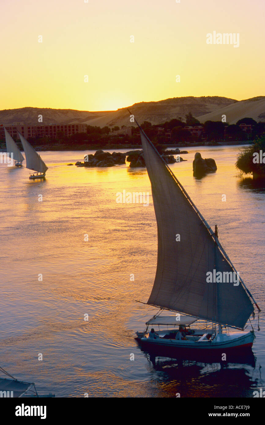 Egypt Aswan sunset on the Nile river feluccas Stock Photo - Alamy