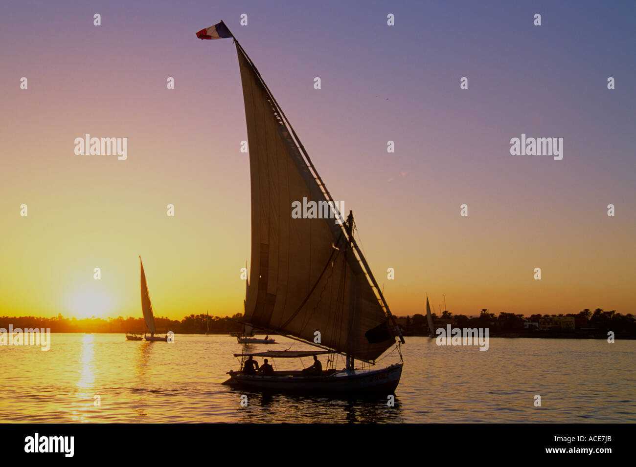 Egypt Aswan sunset on the Nile river feluccas Stock Photo - Alamy