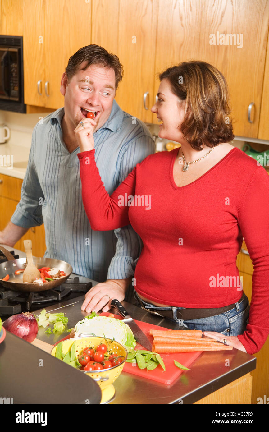 Couple cooking together Stock Photo - Alamy